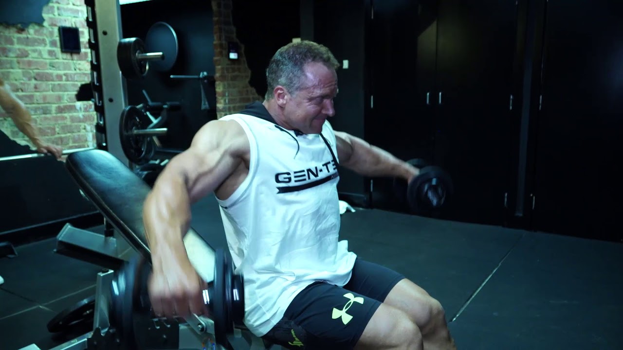 Shoulder superset: plate raises and seated lateral raises - YouTube