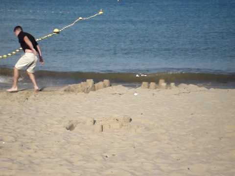 Destroying sand castles - YouTube