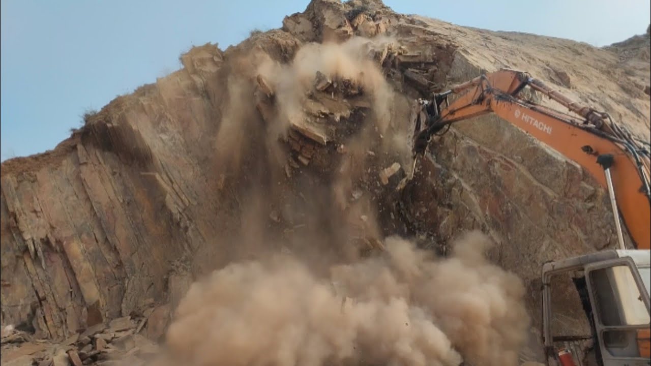Breaking Big rocks with Hitachi Excavator Machine Equipped with ...