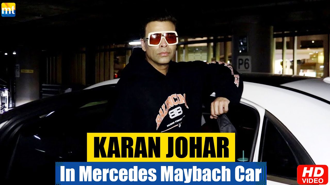 Karan Johar returns from Doha post shoot, gives a stylish pose to paps ...
