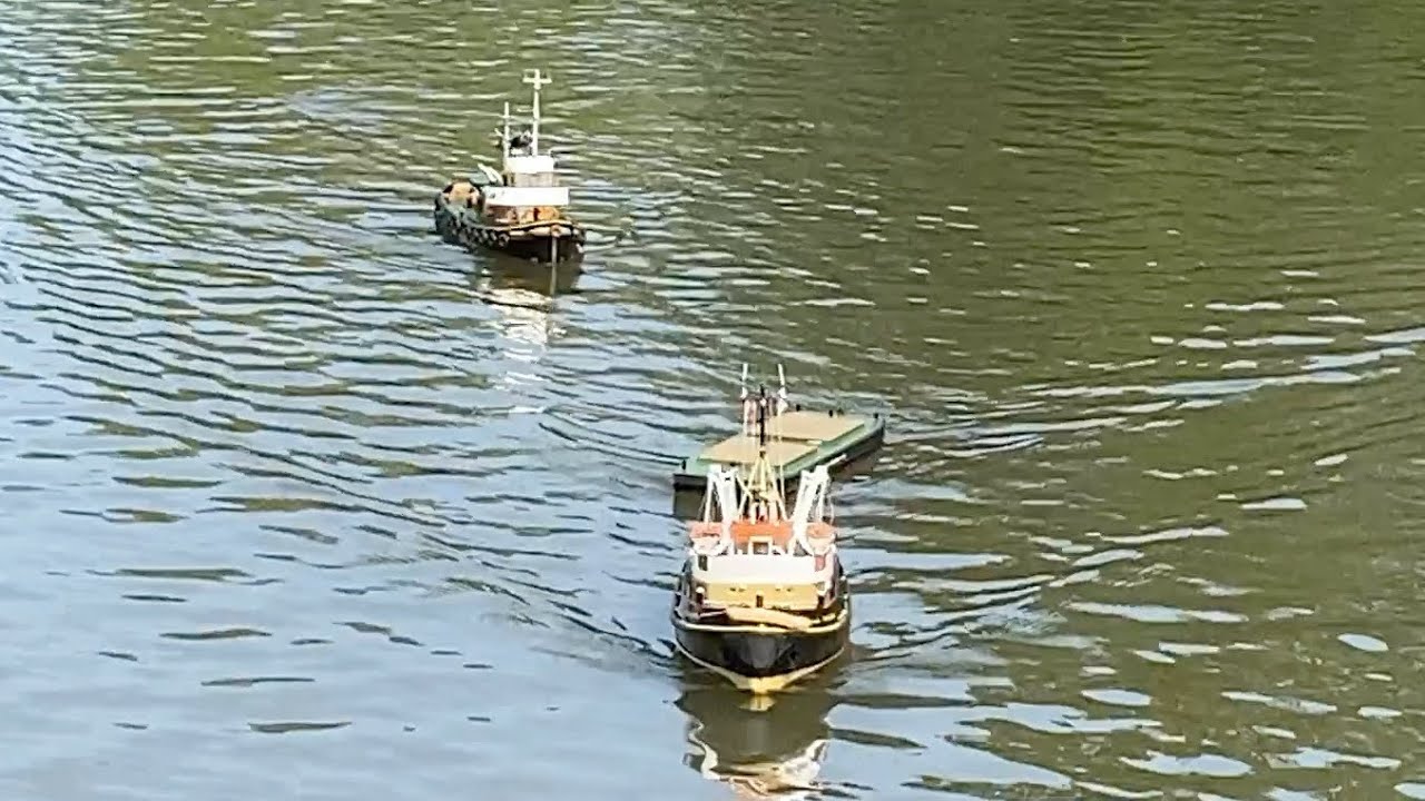 Two RC tugs and a barge on the pond in Herne Bay - YouTube