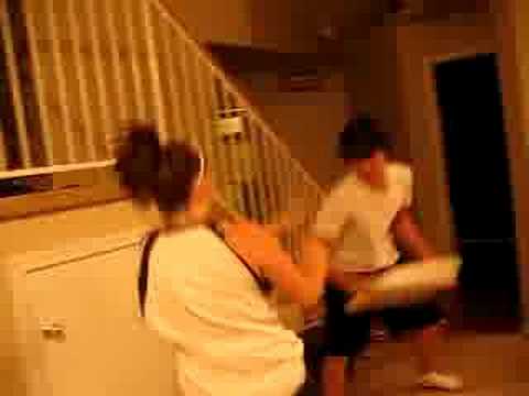 sister beating up brother =]