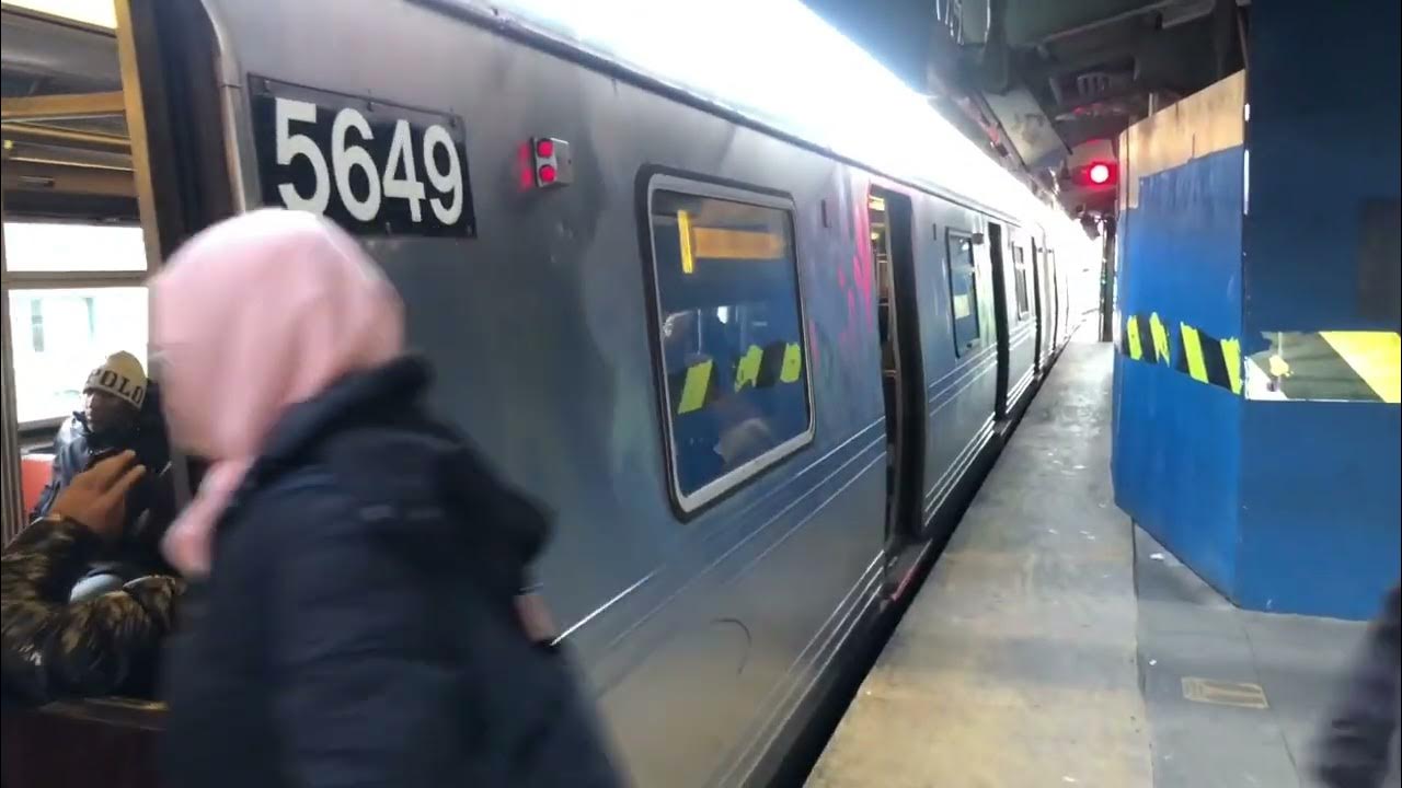 R46 N train being held at Queensboro Plaza, with two R188 7 trains entering and leaving the ...