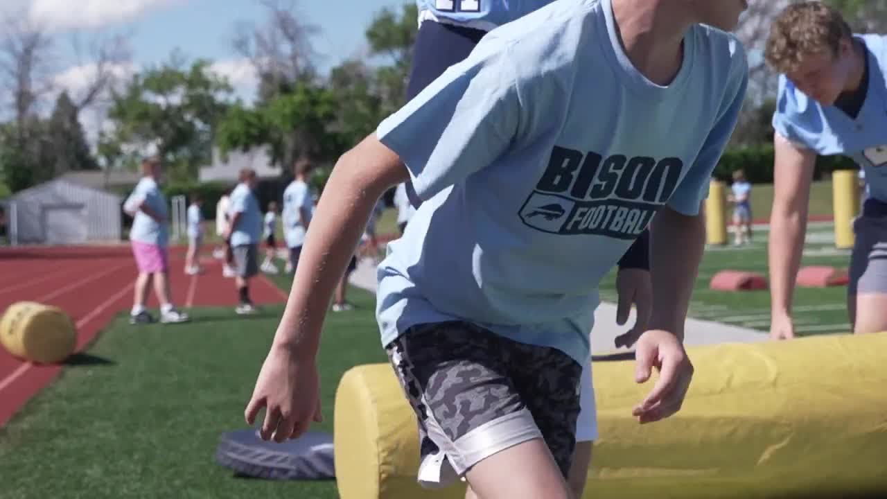 Bison players take the lead at Great Falls kids football camp - YouTube