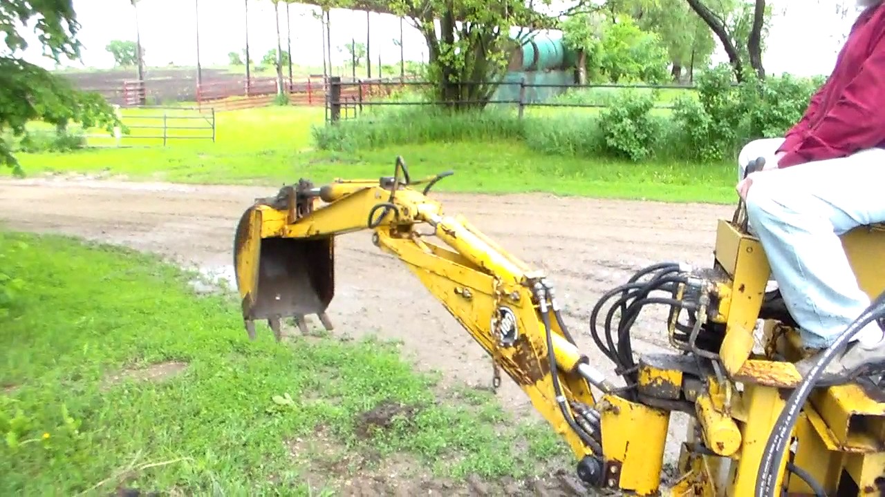 Big Iron, Skidloader backhoe - YouTube
