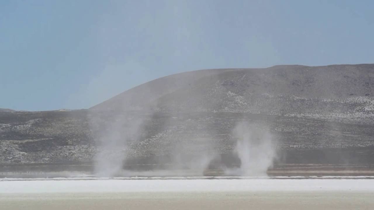 Multiple dust devils on a salt flat (salt devils?) - YouTube
