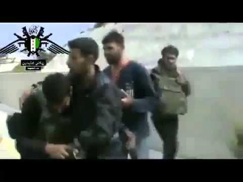 Syria Rebel Soldier Carries Wounded Captured Assad Shabiha on His Back ...