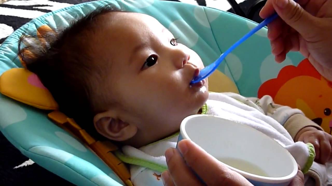Connor crying between rice cereal bites - YouTube