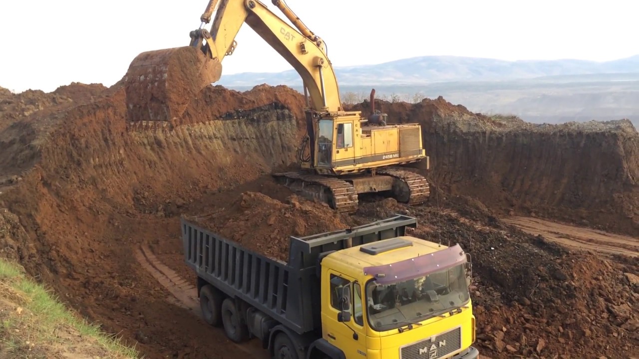Caterpillar 245 Excavator Loading Trucks - YouTube