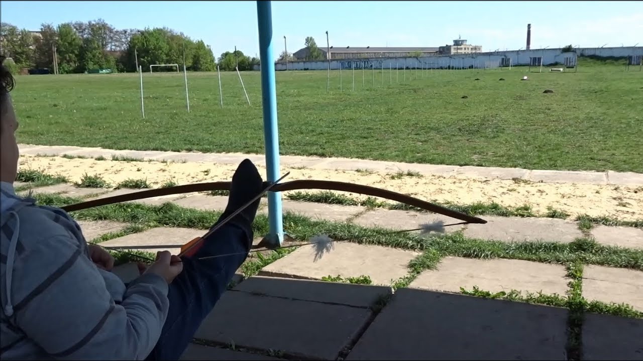 Leg foot archery longbow shot balloon traditional bow trick - YouTube
