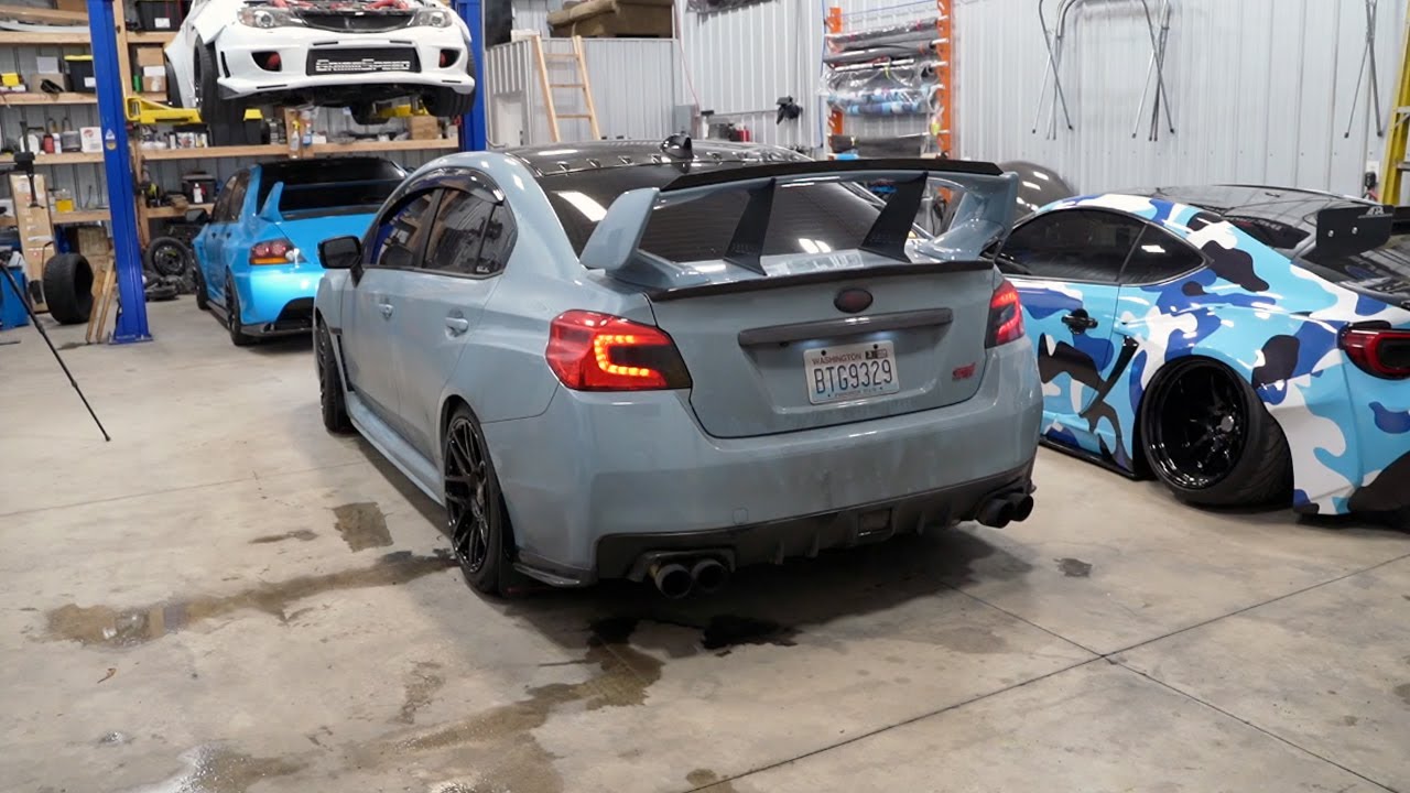 Putting her wrecked STI back to stock - YouTube