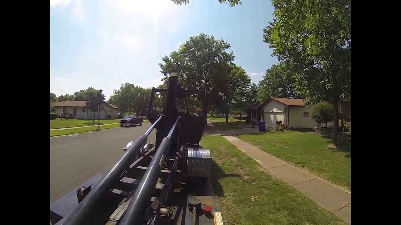 Picking up Hook Lift Flat Bed - YouTube
