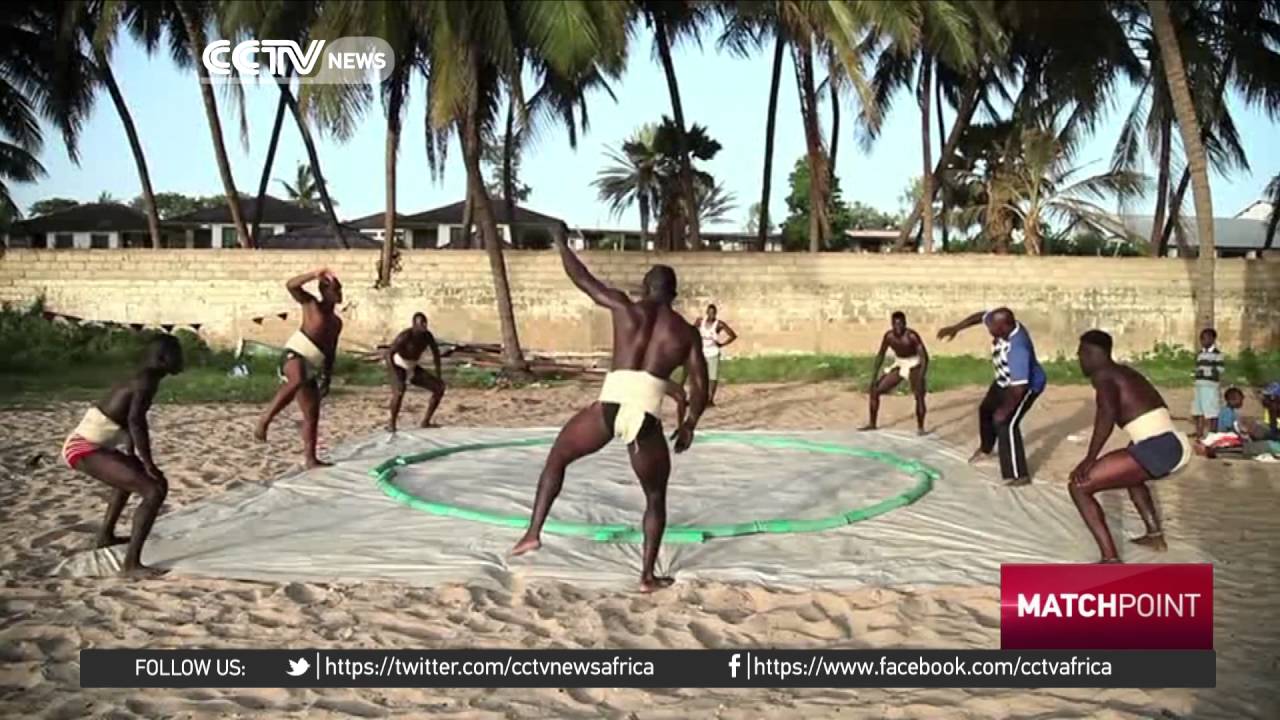 Senegalese traditional wrestlers taking up Sumo wrestling - YouTube
