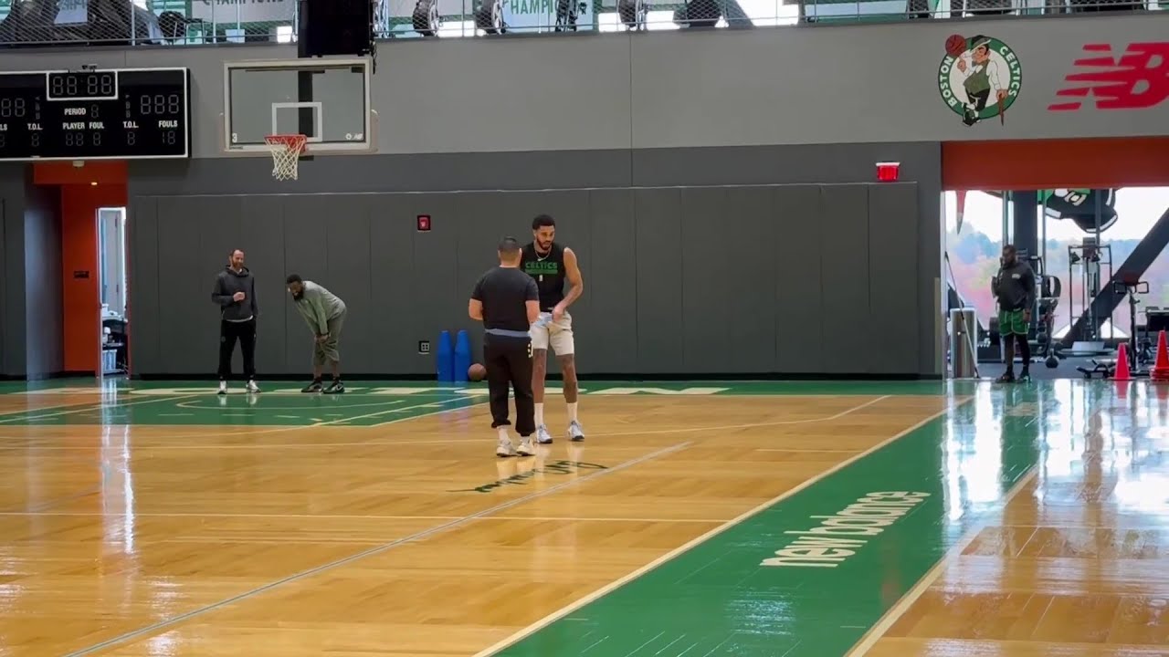 Jayson Tatum is on the court for the start of a workout with trainer ...