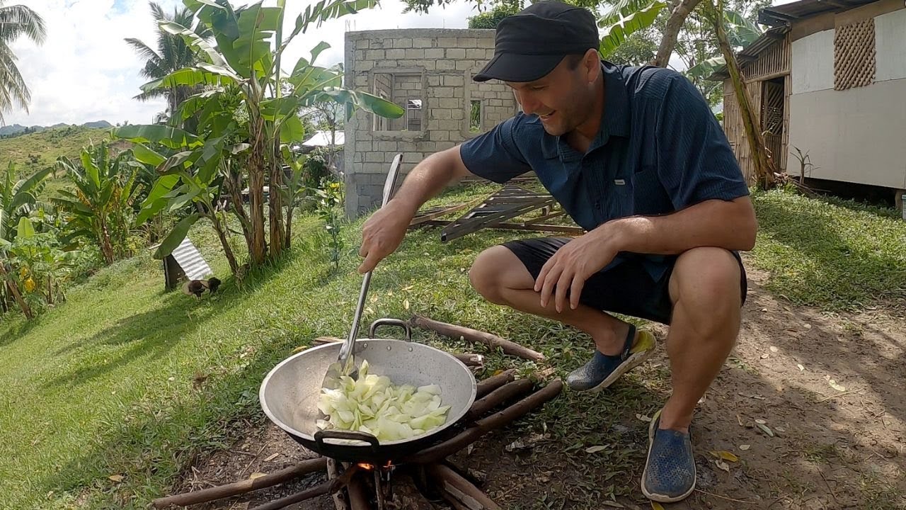Foreigner cooking a Filipino dish over a fire - first day working on ...