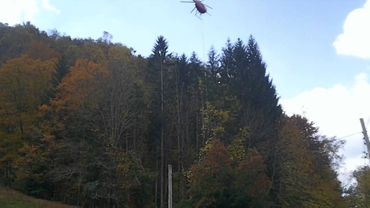 Helicopter tree trimming saw - YouTube