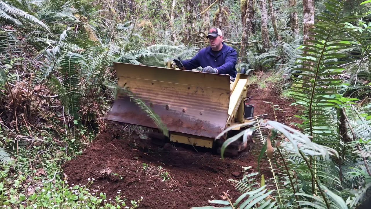 Magnatrac mini dozer trail building - YouTube