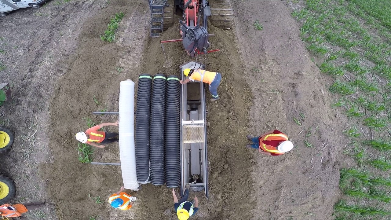 Bron plow installing ADS Dual Wall pipe - YouTube