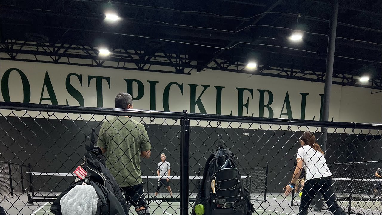Nighttime indoor pickleball courts at West Coast Pickleball of Yorba ...