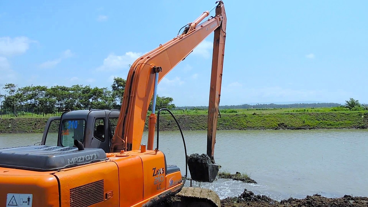 Long Arm Excavator Digging Clearing Mud Sedimentation From The River ...