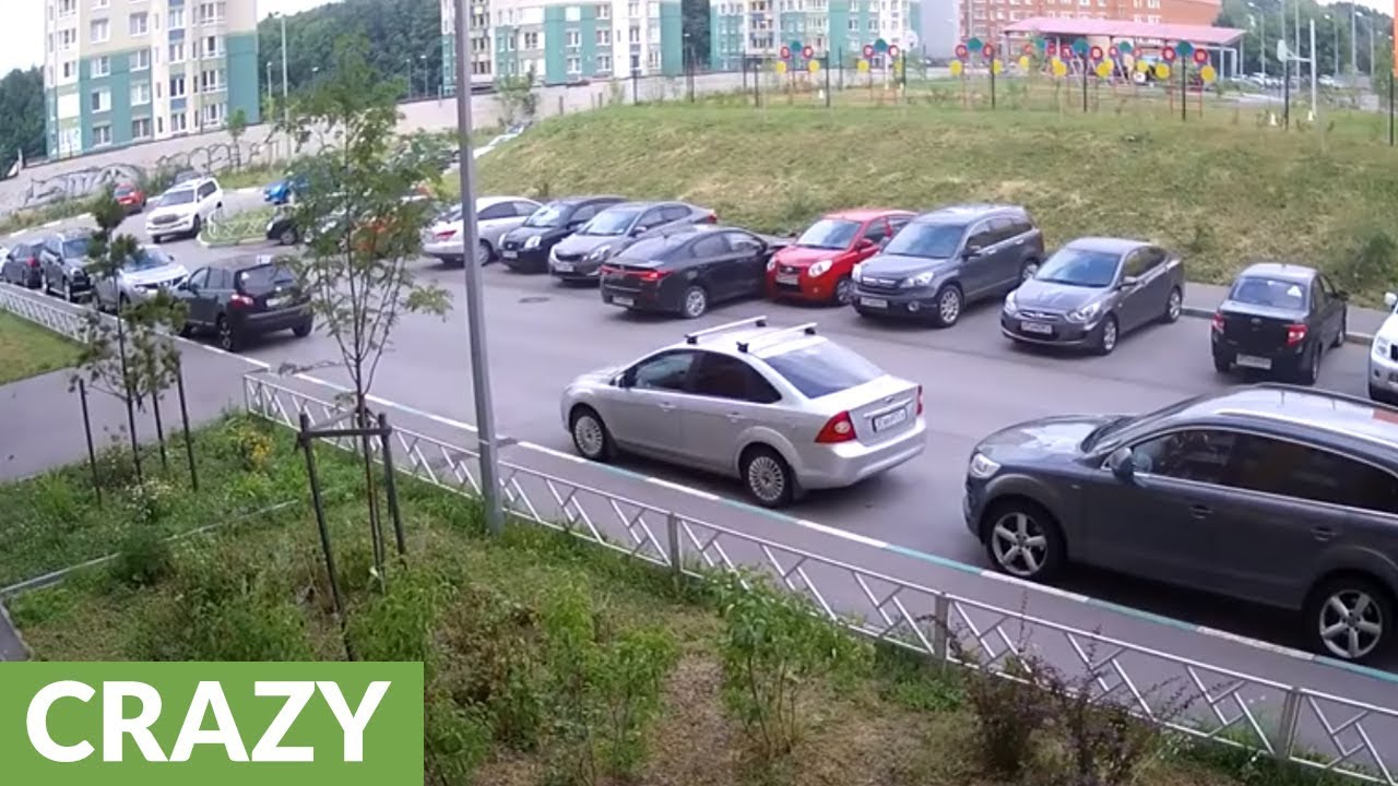Horrible driver crashes into several cars trying to exit parking lot ...