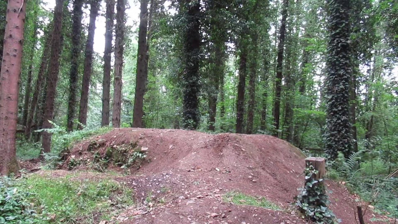 Hitting a table top and a gap jump (MTB) - YouTube