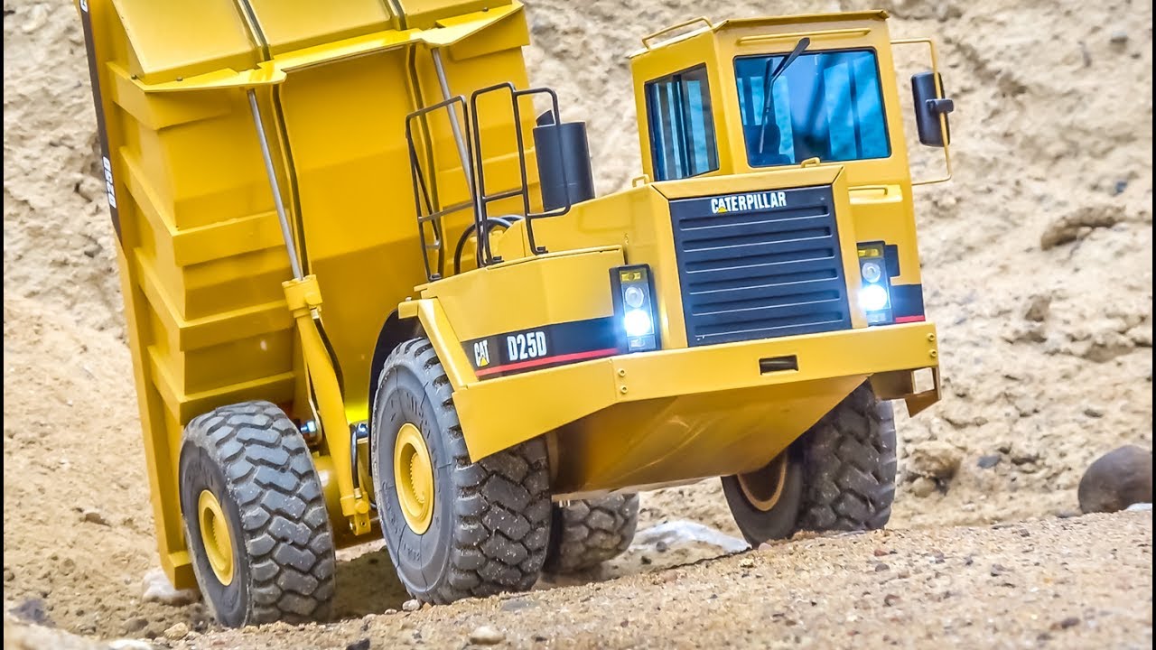BRAND NEW CATERPILLAR D25D dump truck gets dirty! - YouTube