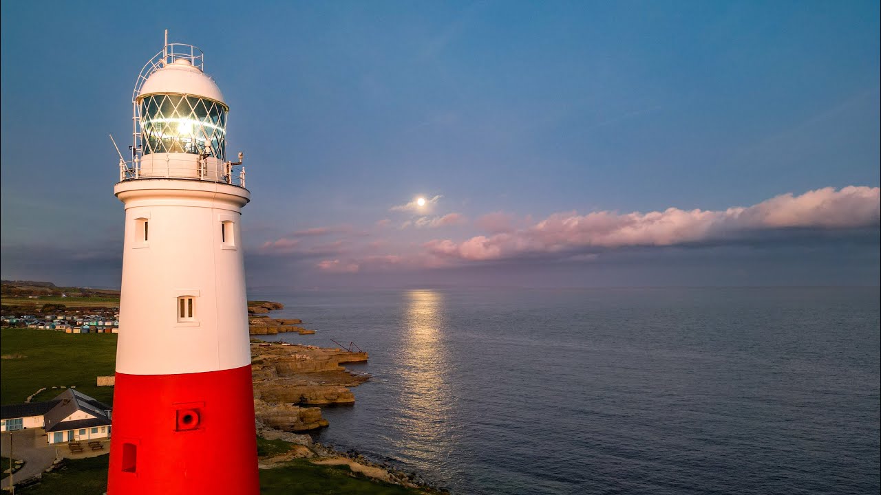 Spectacular sunset and super full moon rise at Portland Bill Dorset, on ...