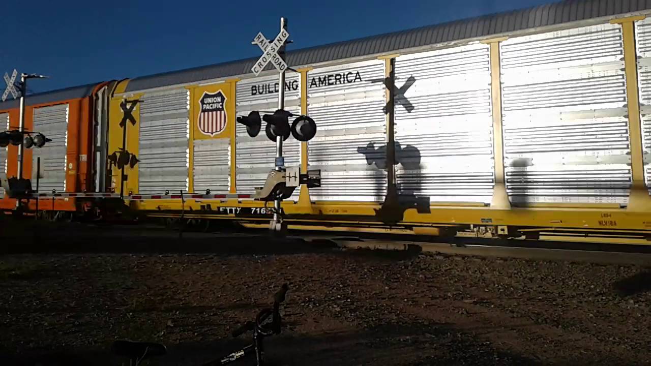 BNSF autorack train at railroad crossing - YouTube