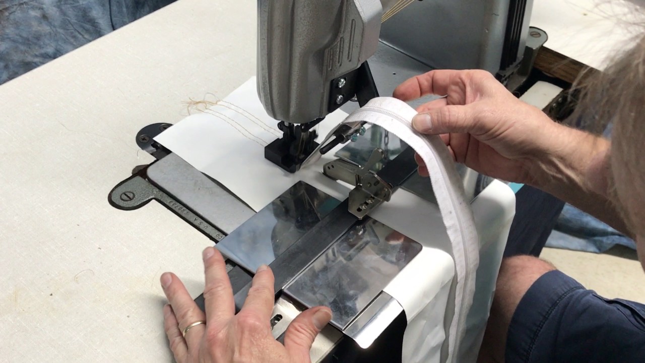 Singer 300W with 4 needle and full zipper setting, plus a center ...