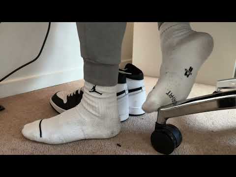 Shoeplay in Nike Air Jordan 1 sneakers and socks