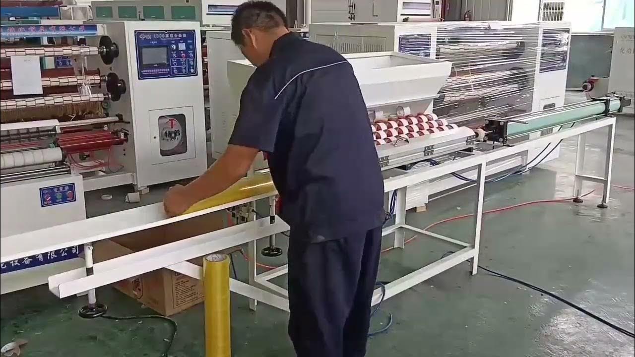 auto paper core loading machine for tape rewinding shaft - YouTube