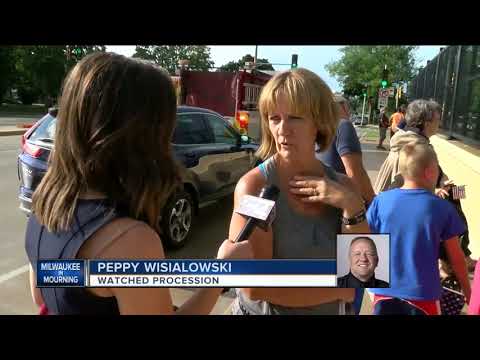 Sirens sound as funeral procession for fallen officer reaches cemetery