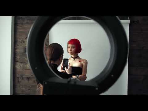 Woman With Red Hair At A Photo shoot In Studio