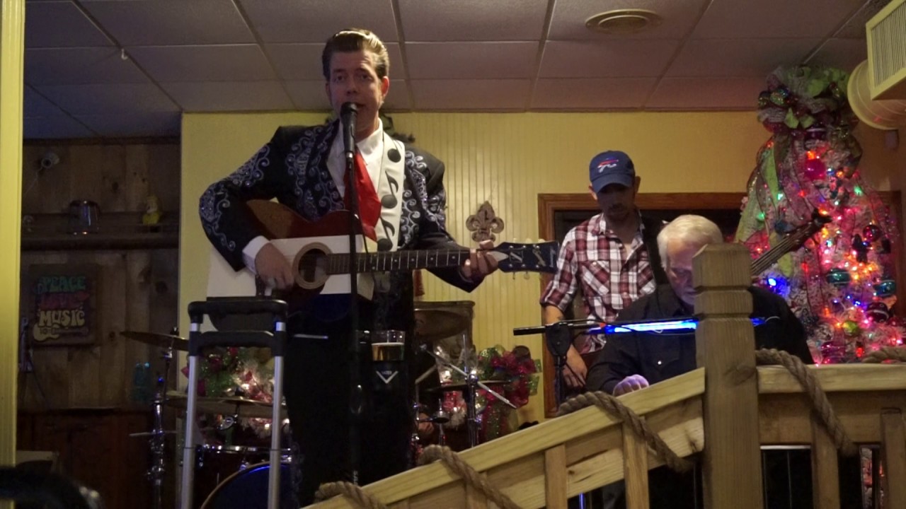 Russ Varnell & His Too Country Band performing Santa looked a lot like ...