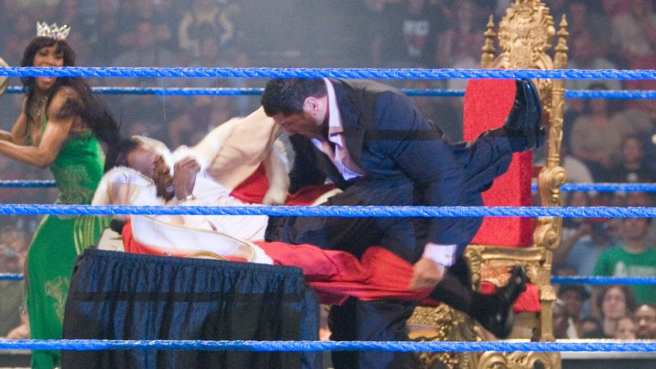 Batista smashes King Booker through a table during contract signing ...