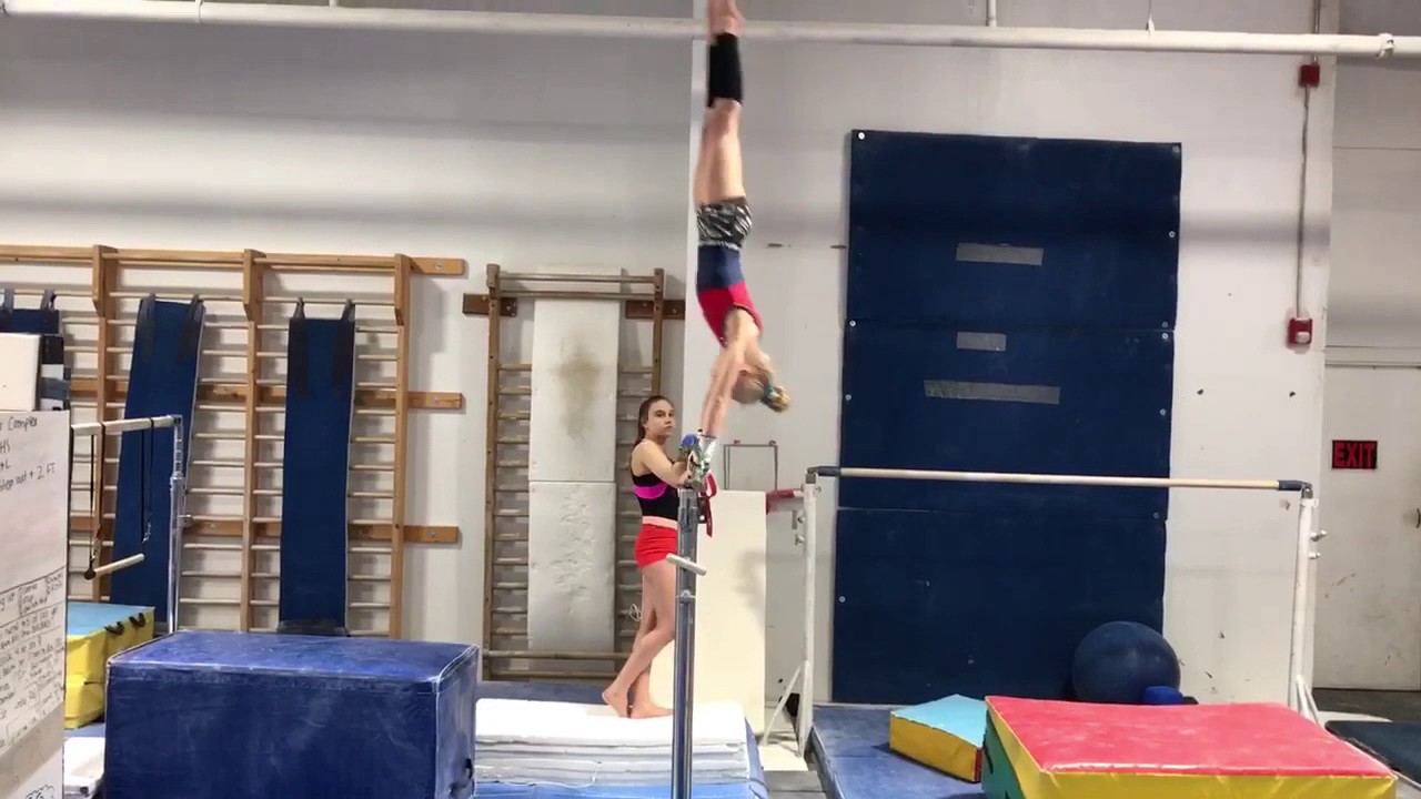 Delaney Bruns- Level 10 - Stalder to Handstand Strap Bar - YouTube