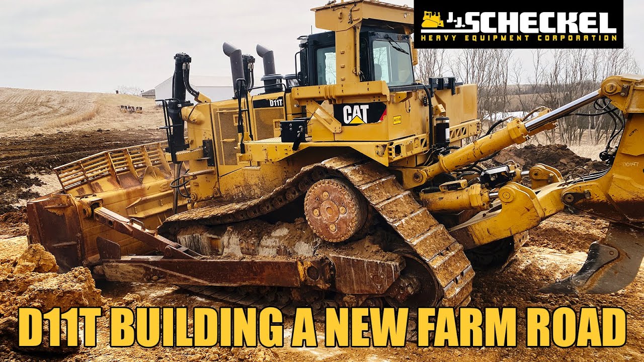 Ride along! CAT D11T dozing and ripping new farm road. - YouTube
