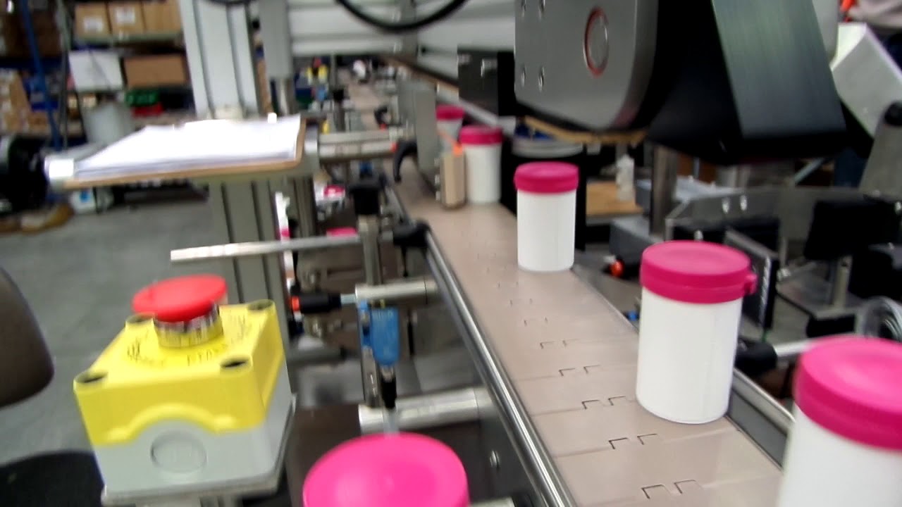 Tapered bottle labelling - YouTube