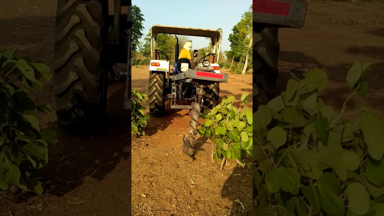 Pit digging for plantation by machine - YouTube