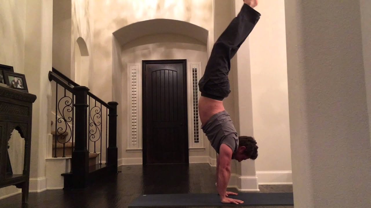 Practicing handstand inversion. Reverses blood flow and improves ...