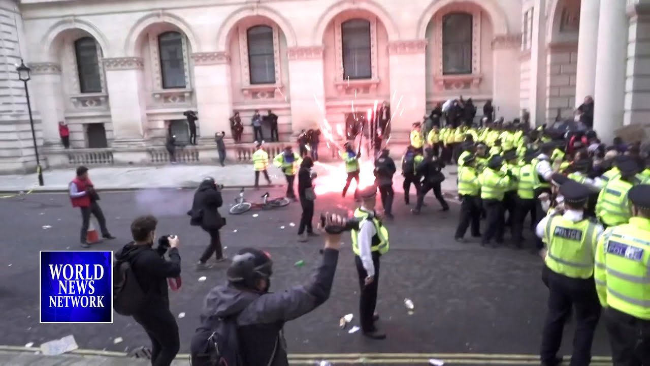 Protesters clash with police in central London - YouTube
