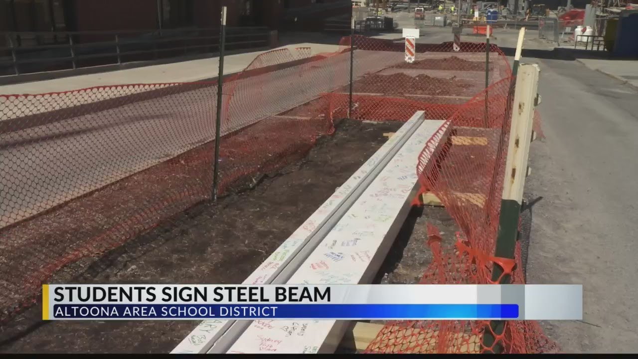 Students sign steel beams - YouTube