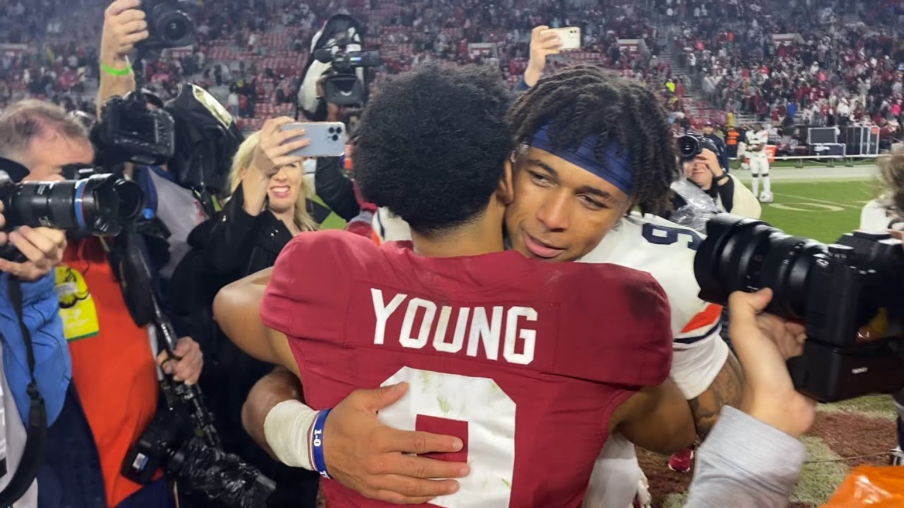 Bryce Young hugs Robby Ashford before walking off the field at Bryant ...