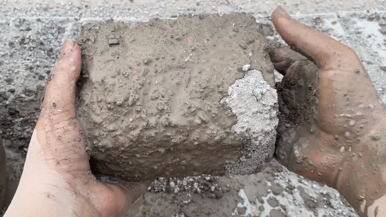 New video gritty white cement dry crumbling in clay pot + water ...