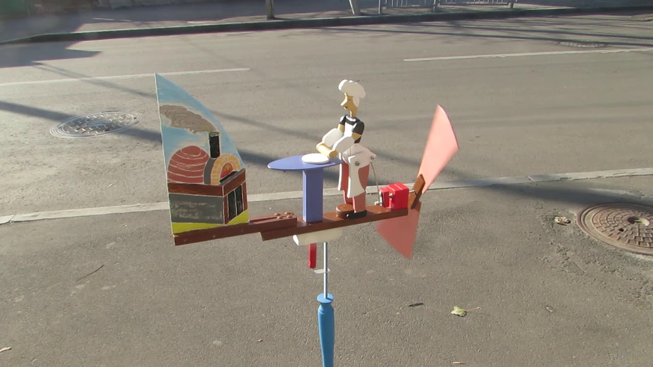 Wind-driven wooden whirligig "Rolling out a Pizza" - YouTube