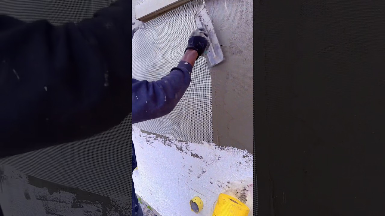 Stucco install in action. Applying scratch coat,embedding mesh, and ...