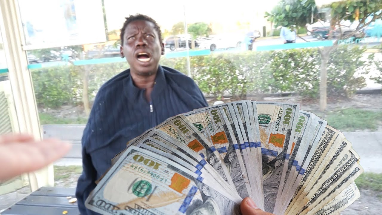 People Giving Money To The Homeless