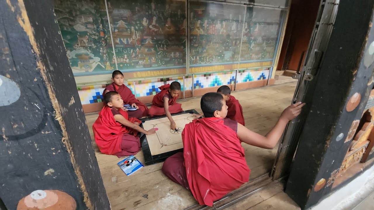 Buddhist monks playing games in the rain - YouTube