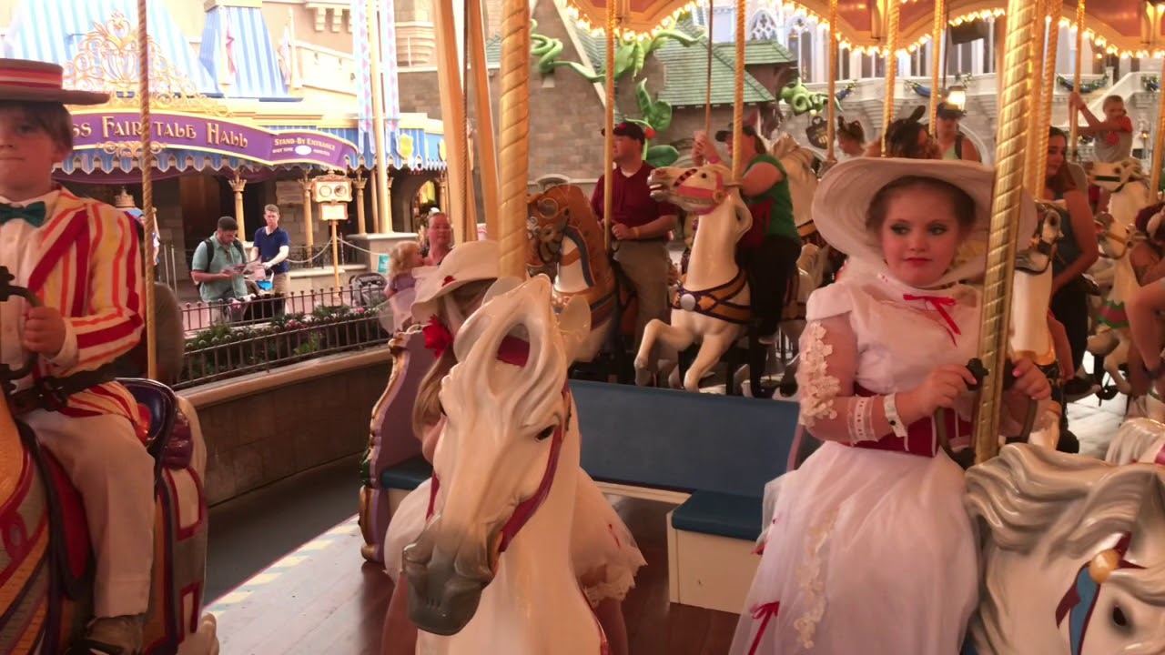Riding the carousel in Magic Kingdom - YouTube